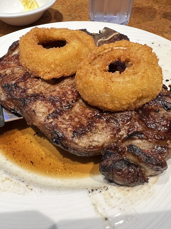 This steak with onion rings isn't just dinner &ndash; it's performance art for carnivores. The sear alone deserves a standing ovation.