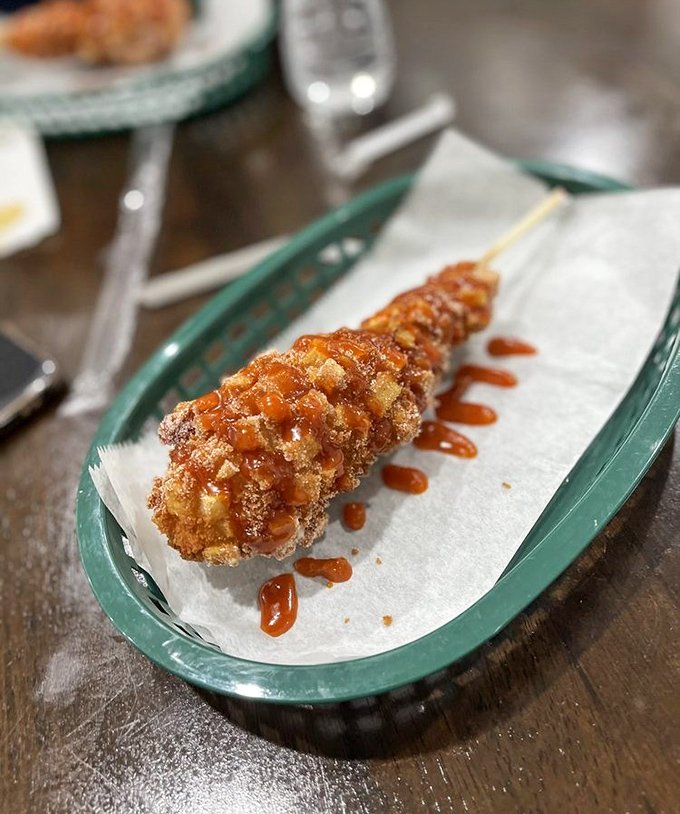 This potato-crusted corn dog on a stick proves that sometimes the best culinary innovations come from asking "what if?"