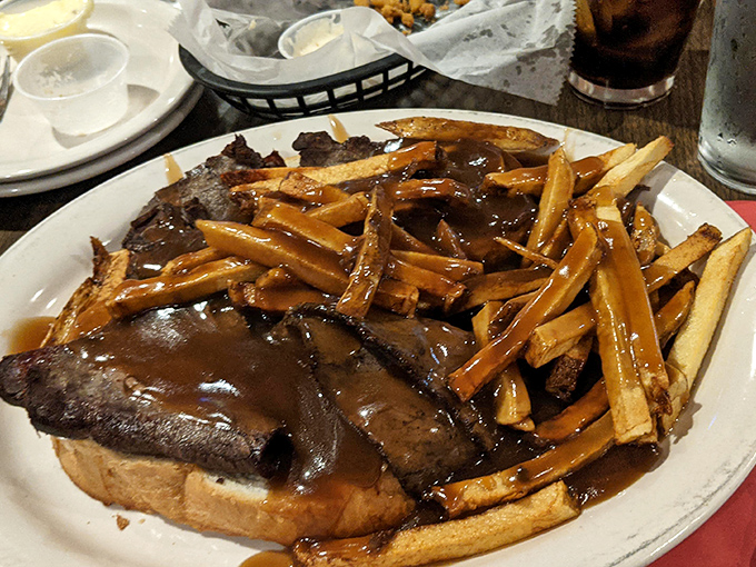 Open-faced roast beef that doesn't just come with gravy&mdash;it practically swims in it. This isn't a meal, it's a delicious brown flood with fries as lifeboats.