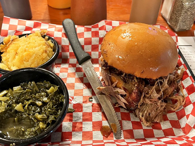 The pulled pork sandwich that launched a thousand road trips, flanked by sides that refuse to be mere afterthoughts.