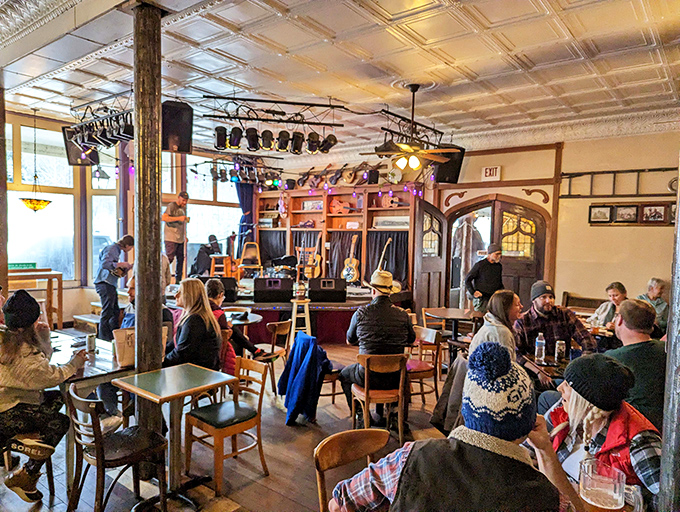 Inside the Purple Fiddle, strangers become friends over shared tables, local brews, and toe-tapping tunes that seem to rise from the floorboards.