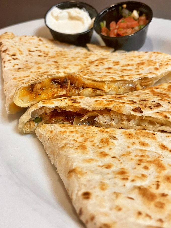 Quesadillas that achieve that perfect golden-brown exterior while keeping their molten secrets tucked safely inside. The cheese pull is real, folks.