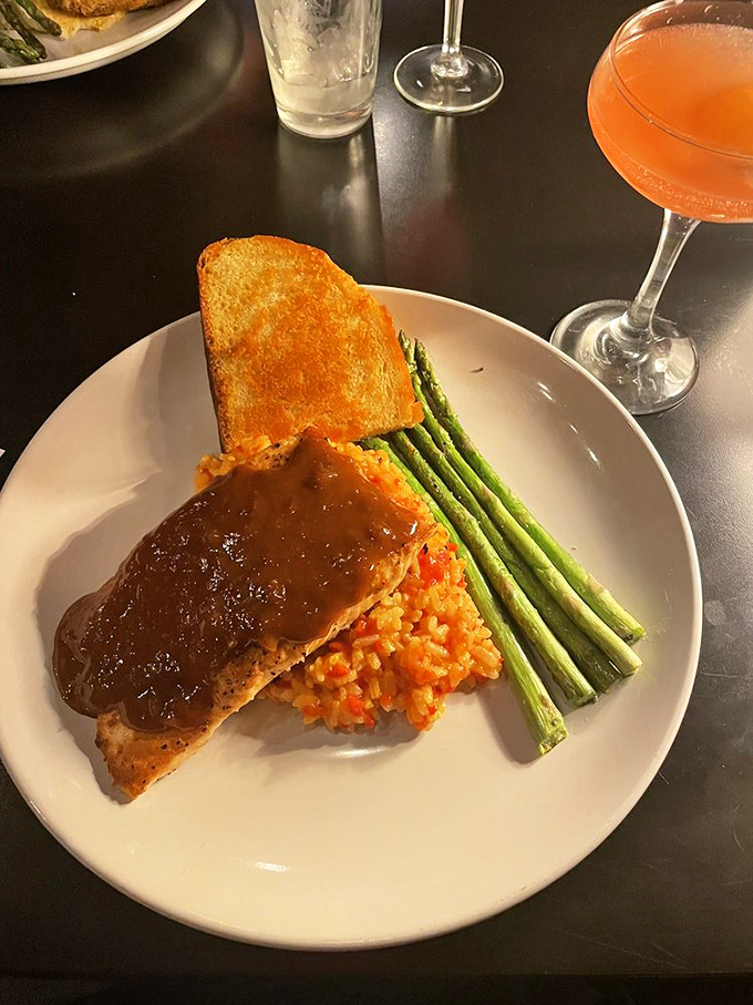 Bourbon-glazed salmon with perfectly cooked vegetables proves Cooper's elevates every dish to restaurant-quality excellence without the pretentious attitude. 