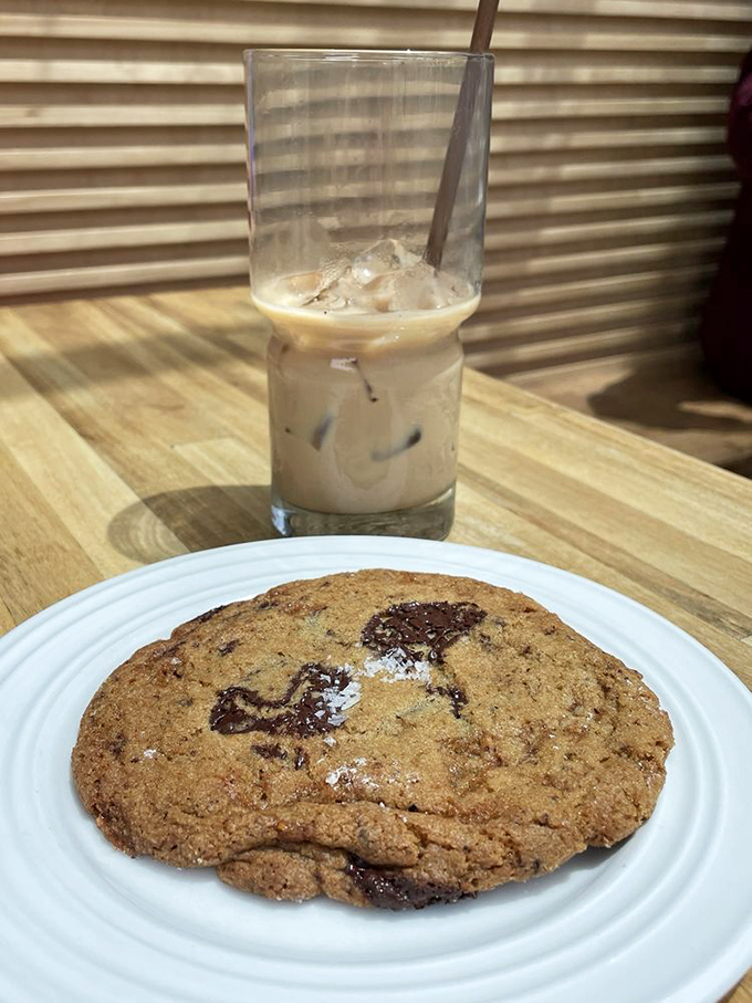 A cookie and iced coffee&mdash;the dynamic duo of afternoon pick-me-ups. That melted chocolate is performing a siren song visible to the naked eye.