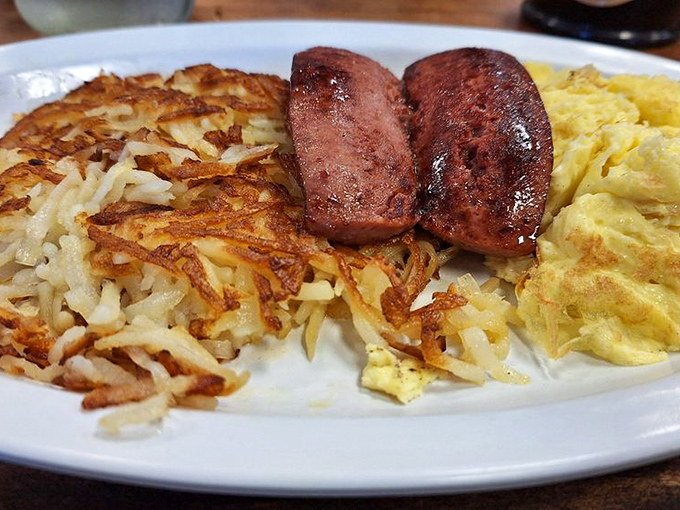 Breakfast that doesn't whisper "good morning"—it belts it out with crispy hashbrowns that crackle with every fork piercing.