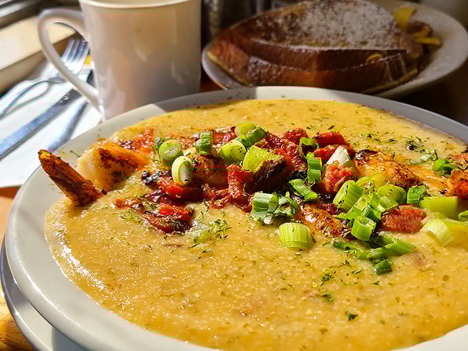 Shrimp and grits: where creamy Southern comfort meets fresh Keys seafood. The scallions aren't garnish &ndash; they're the perfect finishing touch.