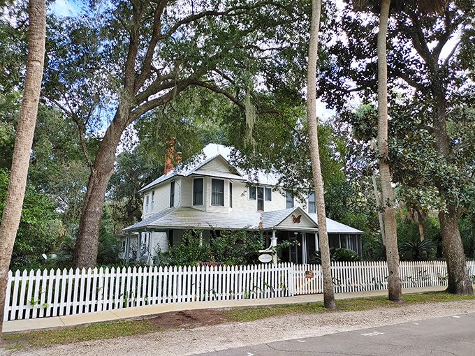 This stately white home surrounded by nature's finest landscaping makes modern McMansions look like they're trying way too hard.