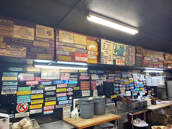 Layer upon layer of signs and memories &ndash; this wall has absorbed more barbecue wisdom than most pitmasters acquire in a lifetime.