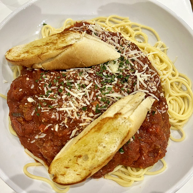 Spaghetti that would make nonna proud&mdash;al dente pasta swimming in robust sauce, topped with freshly grated cheese and garlic bread for essential sauce-sopping.