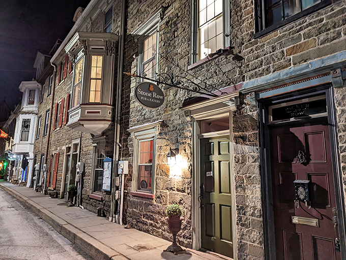 Stone Row Pub & Eatery by night, when the stone walls practically whisper tales of the past. History with a side of dinner.