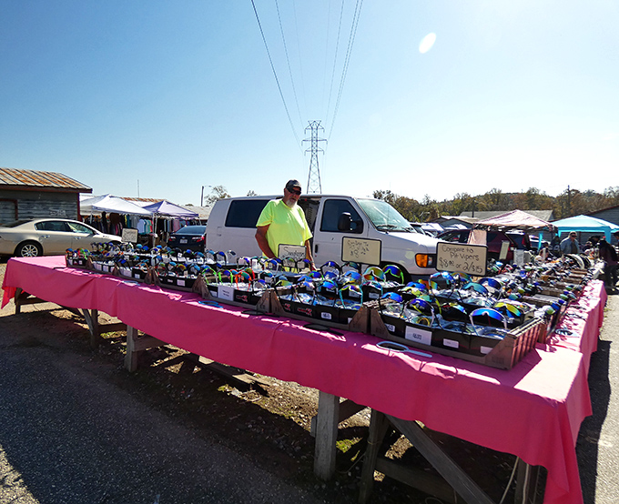 Outdoor vendor optimism! Nothing says "I believe in sunny days ahead" like a table full of shades under North Carolina's open skies.