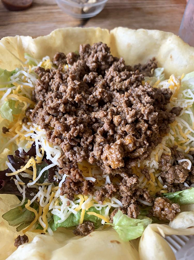 This taco salad isn't messing around &ndash; a crispy shell fortress protecting a treasure of seasoned beef, cheese, and fresh vegetables.