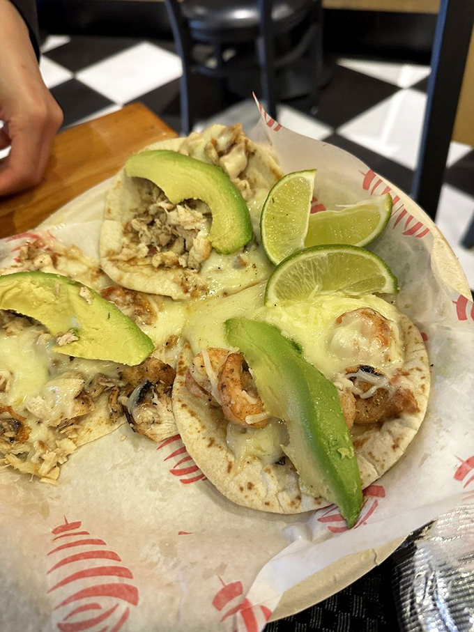 Fresh lime wedges and creamy avocado slices elevate these tacos from simple street food to a celebration worthy of your taste buds.