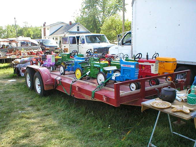 Colorful vintage pedal tractors lined up on a trailer&mdash;childhood nostalgia that appeals to both the 8-year-old and the 58-year-old in all of us.