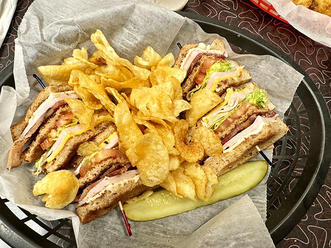 The club sandwich—architecture you can eat, with layers stacked higher than your weekend to-do list and twice as satisfying.