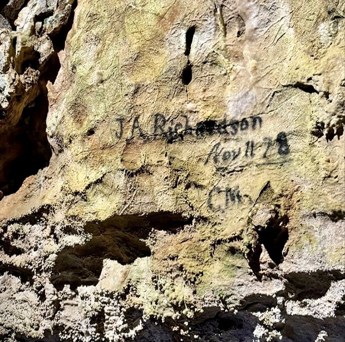 Historical graffiti or important documentation? This 1878 signature marks the cavern's discovery, proving that humans have always had the urge to write "I was here."
