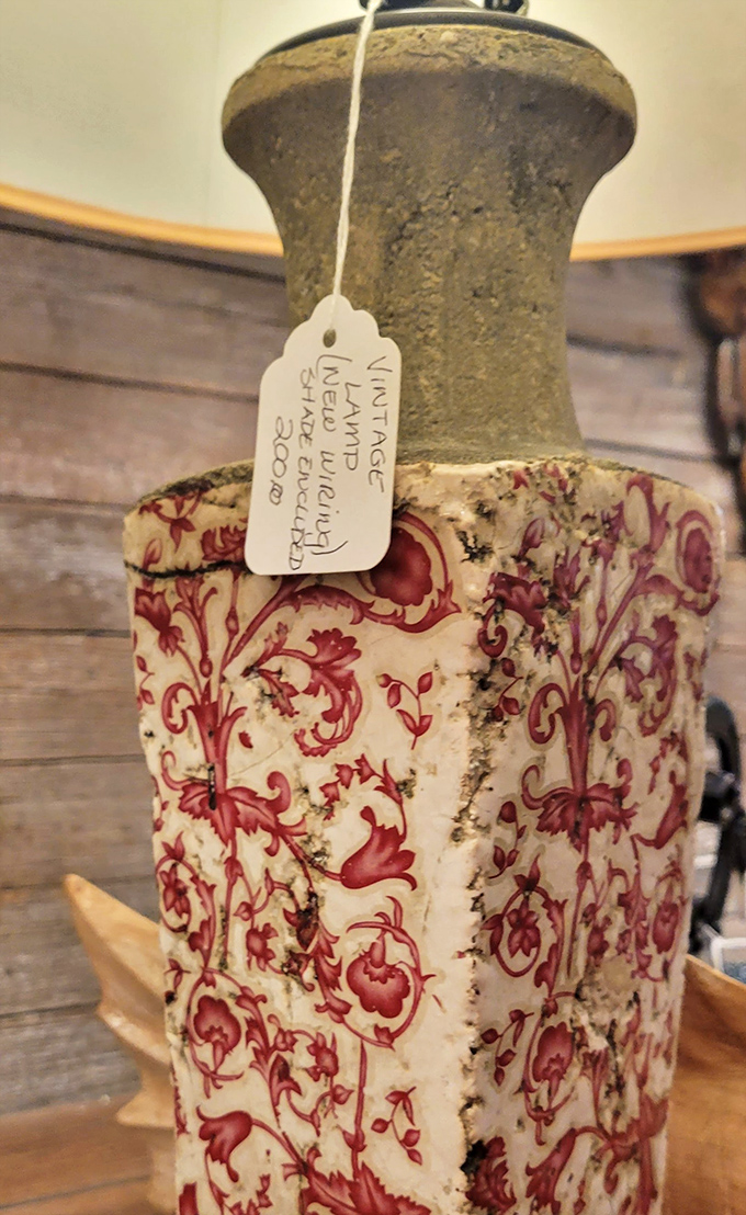 This isn't just a vintage lamp &ndash; it's a conversation piece with a tag that hints at its journey from someone's elegant parlor to your treasure-hunting hands.