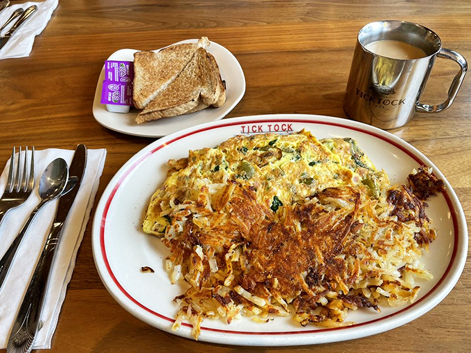 An omelet that could feed a small country, packed with hash browns that have achieved that perfect crispy-to-tender ratio. Breakfast of champions.