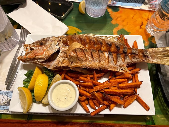 When a whole fish arrives looking this good, you know you've made excellent life choices. Those sweet potato fries aren't slouching either.