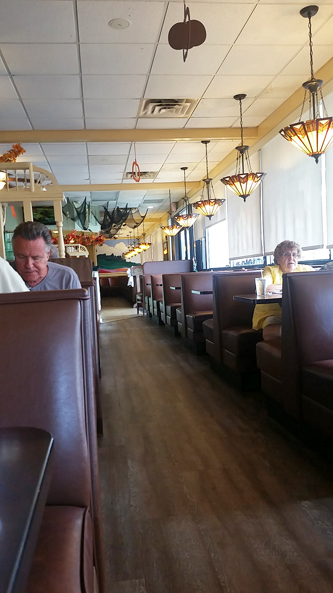 The dining room stretches invitingly, promising plenty of space for your waffle-induced food coma recovery session.