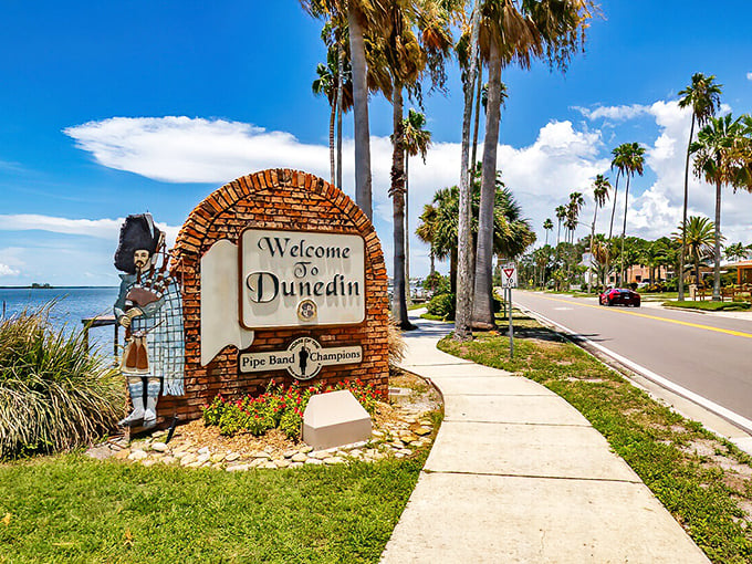 Dunedin's welcome sign features a bagpiper statue that stands guard like Scotland's ambassador to the Sunshine State.