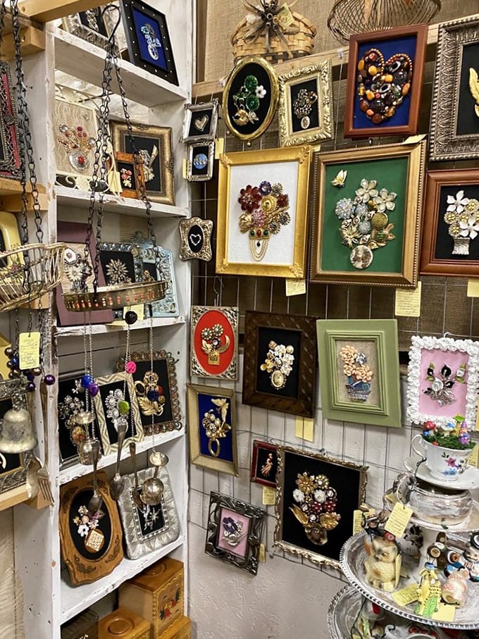 A gallery wall of vintage jewelry art that puts modern craft stores to shame. Each frame contains someone's precious memories, repurposed as wall decor.