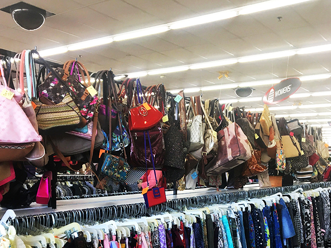 Handbag heaven hanging overhead like fashionable fruit. Designer labels hide among everyday brands&mdash;can you spot the diamond in the rough?