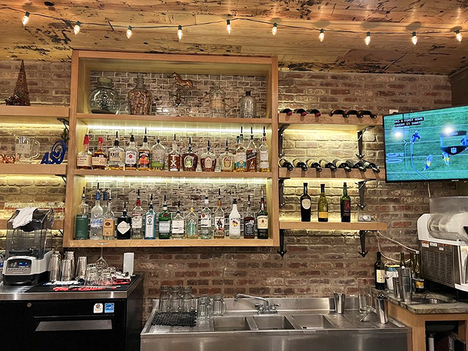 The bar area showcases an impressive array of spirits against exposed brick&mdash;where decisions about bourbon are taken as seriously as football.