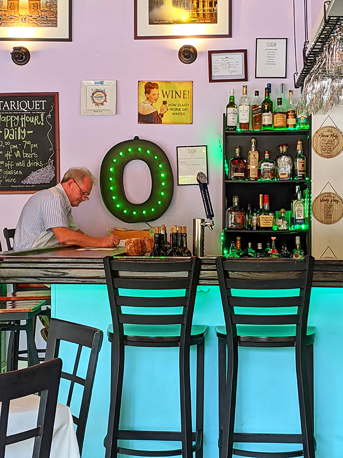 The bar's illuminated blue glow creates an atmosphere that says, "Your day is officially over, and the good part is just beginning."