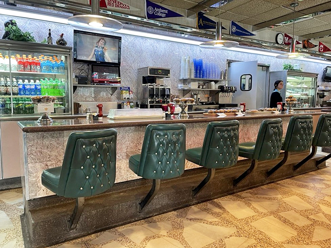 The counter seats&mdash;where solo diners become temporary members of the Roscoe family, watching short-order ballet while college pennants flutter overhead.