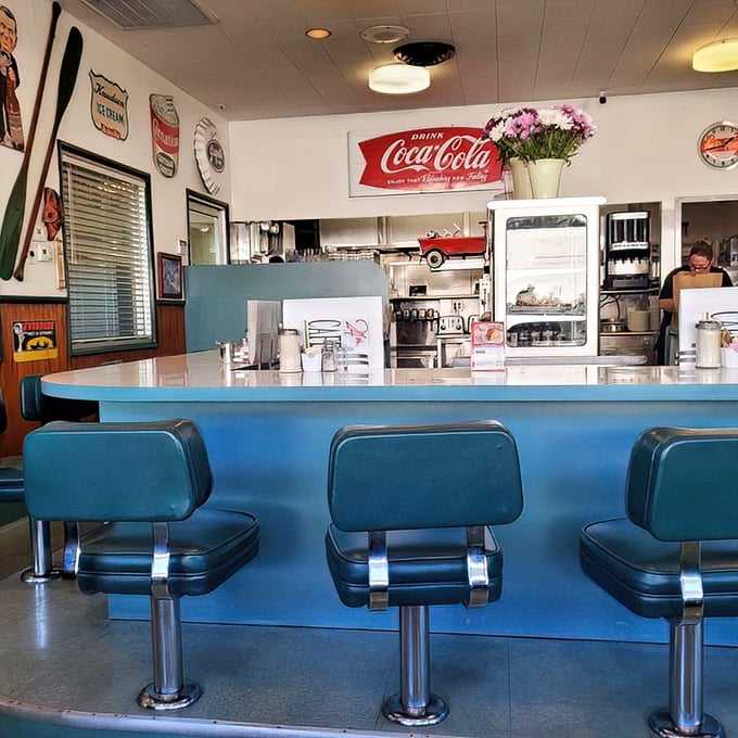 Classic blue counter stools and vintage Coca-Cola signs&mdash;time travel is possible, and it comes with coffee refills.