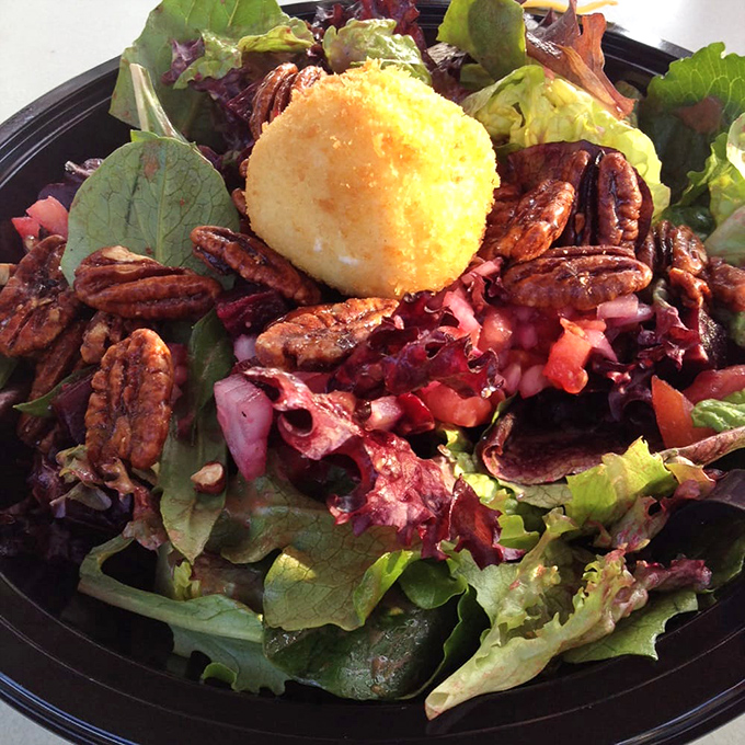 This isn't just a salad—it's a rebellion against boring greens. Candied pecans, beets, and a golden orb of fried goat cheese.