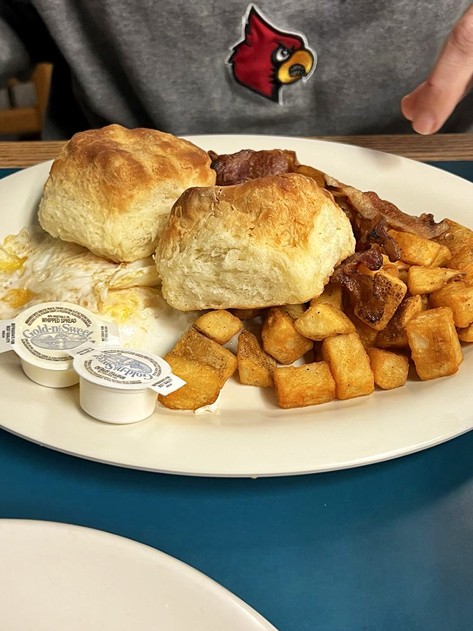Biscuits that could make your grandmother jealous paired with perfectly cubed breakfast potatoes. This is the fuel that powers Derby dreams.