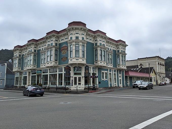 The Victorian Inn anchors the corner of Main Street with a blue facade that has witnessed over a century of Ferndale history while still welcoming modern travelers.