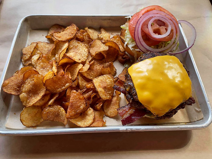 The burger arrives like automotive royalty&mdash;melty cheese, perfect patty, and house-made chips crispy enough to make you forget all other potato products.