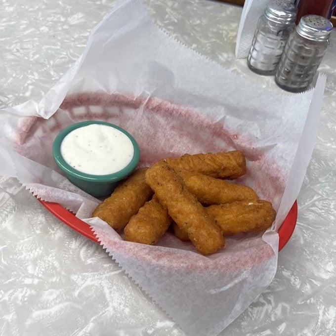 Cheese sticks that stretch their golden arms toward you like old friends. That dipping sauce isn't optional&mdash;it's the perfect dance partner.