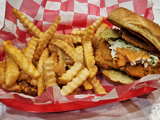This isn't just a sandwich; it's an architectural marvel of crispy chicken, tangy sauce, and fresh toppings that demands a two-handed commitment.