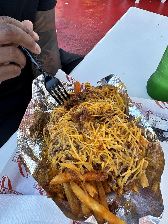 Chili fries that require both fork and napkin strategy, plus possibly a change of clothes afterward.