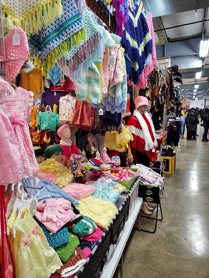 Handcrafted sweaters and colorful garments hang like textile waterfalls, showcasing the kind of craftsmanship that's becoming increasingly rare in our mass-produced world.