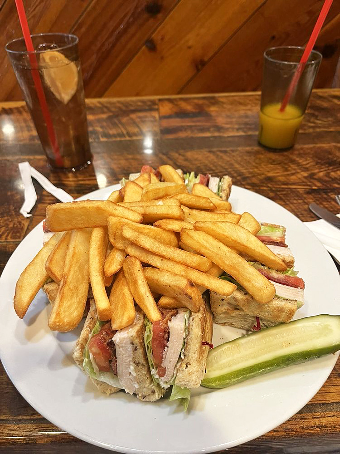 The club sandwich: three stories of deliciousness where every floor is better than the last. Those fries deserve their own fan club.