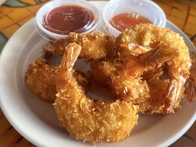 Coconut shrimp that look like they just returned from vacation with a golden tan and stories to tell.