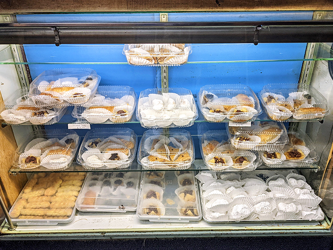 The dessert case: where willpower goes to surrender. Resistance is futile, but oh so sweetly rewarded.