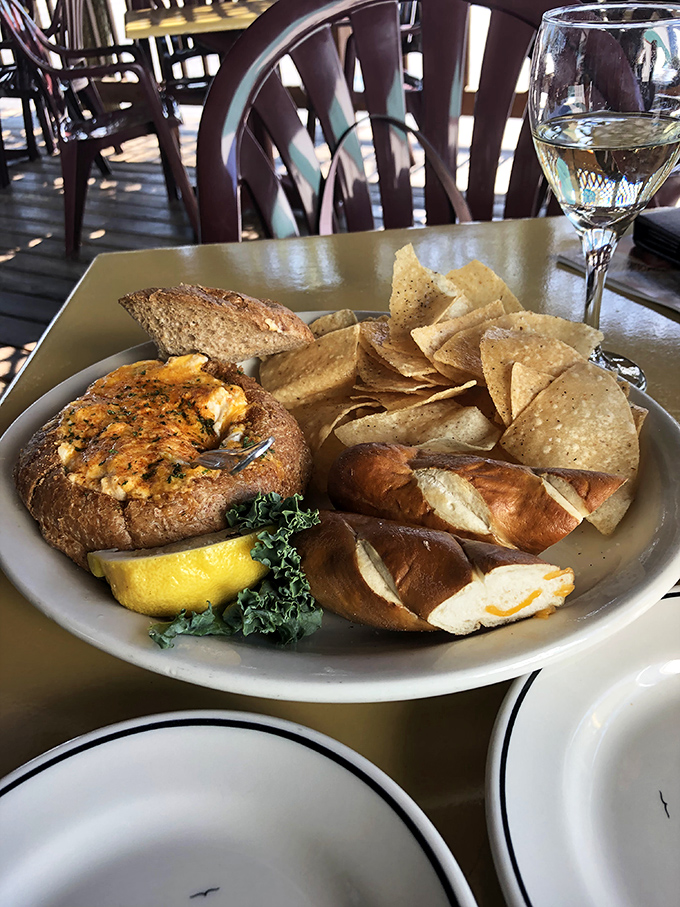 This bread bowl of crab dip isn't just an appetizer – it's the beginning of a beautiful friendship between carbs and seafood.