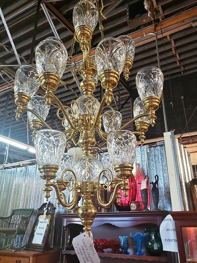 Crystal and brass unite in this magnificent chandelier that once illuminated conversations in parlors long before smartphones stole our attention.