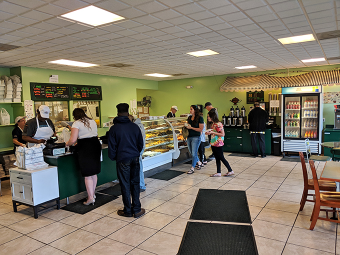 The morning pilgrimage in full swing—locals lining up for their fix of fried dough divinity, a ritual as sacred as the donuts themselves.