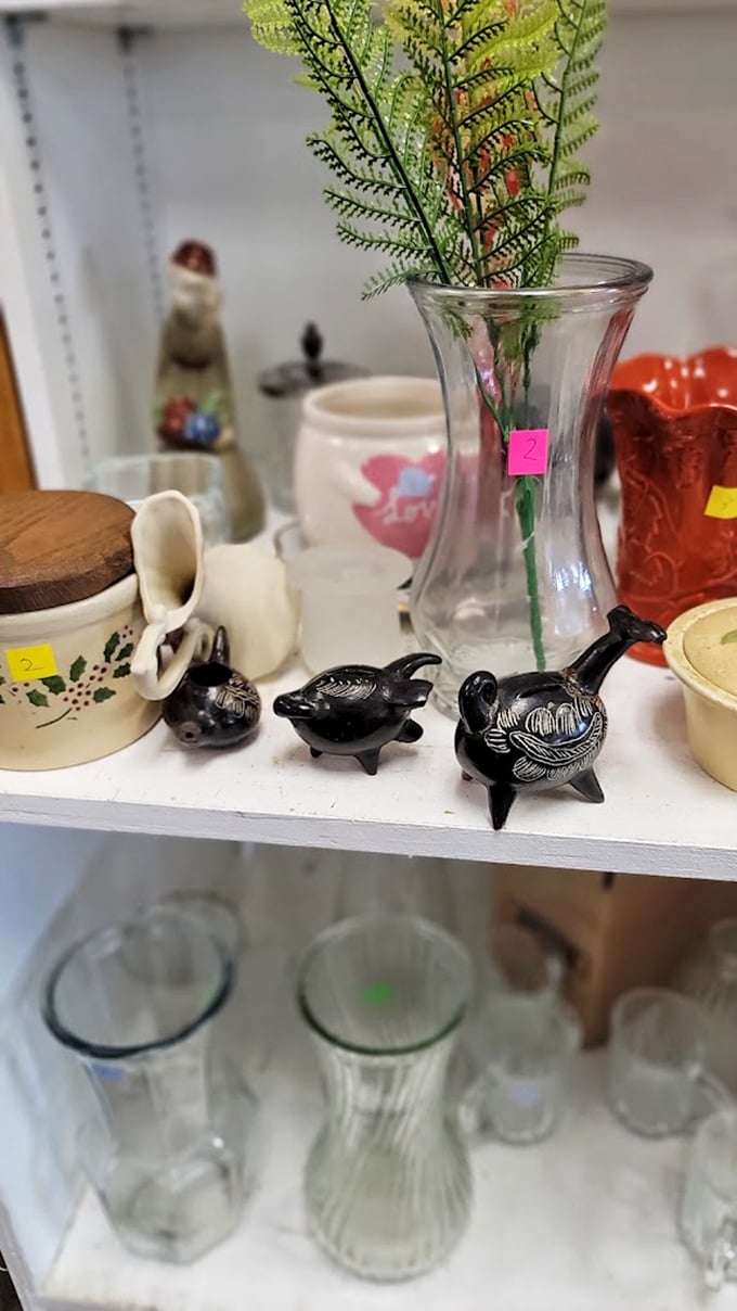Tiny ceramic creatures and vintage glassware stand at attention, silently pleading, "Take me home, I'll look fabulous on your shelf!"