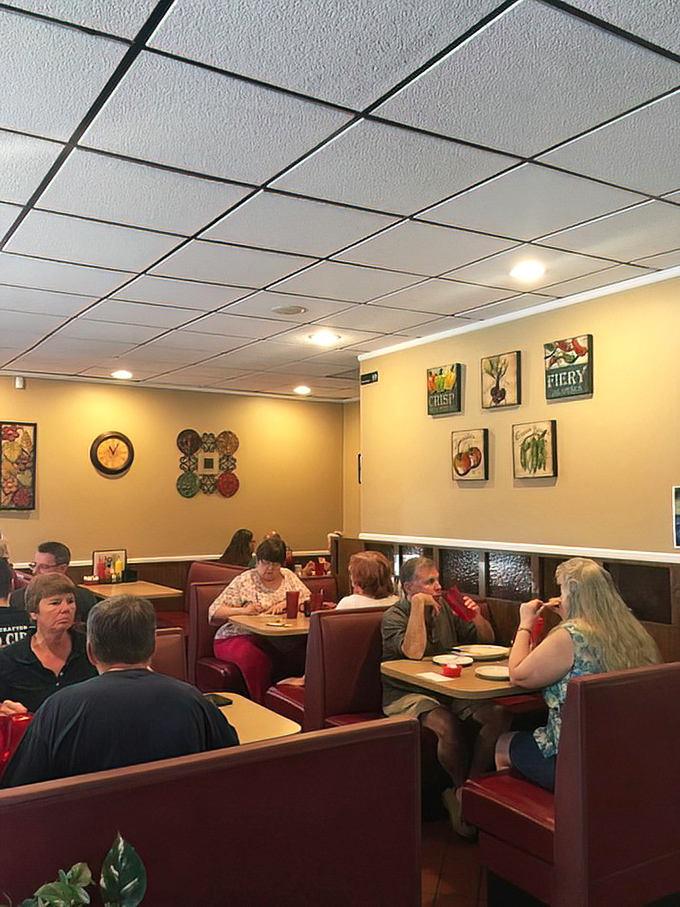 The dining room hums with the authentic rhythm of community&mdash;where regulars and newcomers alike find comfort in red booths and familiar conversations.