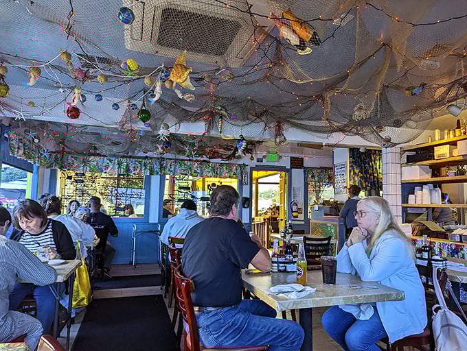 Where fishing nets become ceiling decor and strangers become friends, united by the universal language of "pass the tartar sauce."