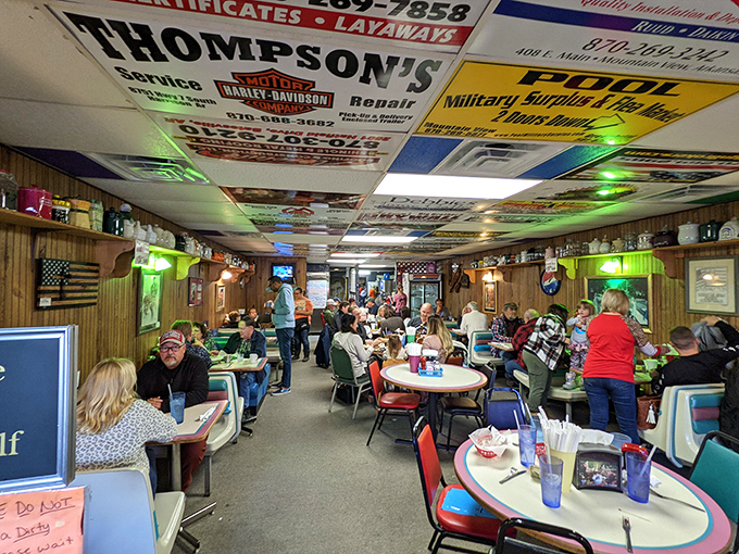 Where locals gather and travelers feel at home – ceiling tiles adorned with business cards tell stories of those who came before.