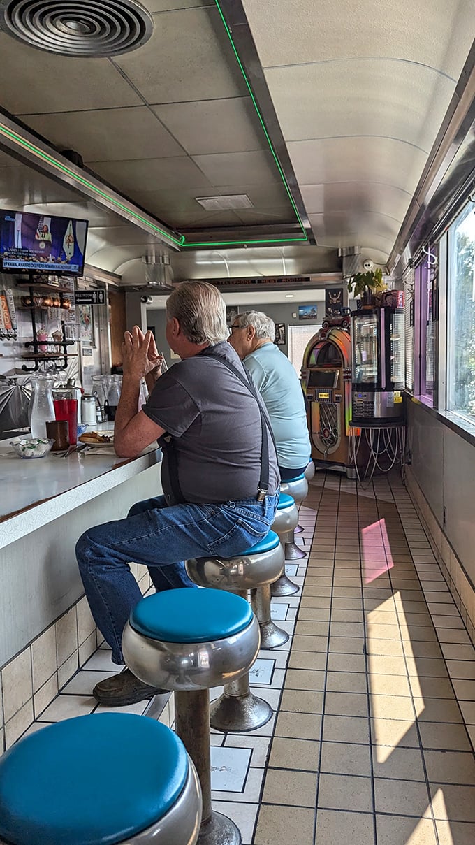 The counter is where the real diner magic happens. These gentlemen know exactly what they're doing&mdash;they've been practicing this ritual for decades. 